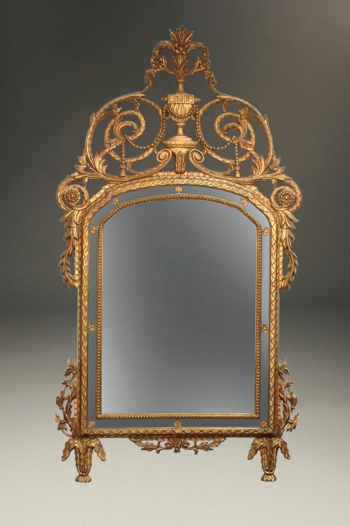Wonderful French gilt mirror with leaf and ribbon motif.